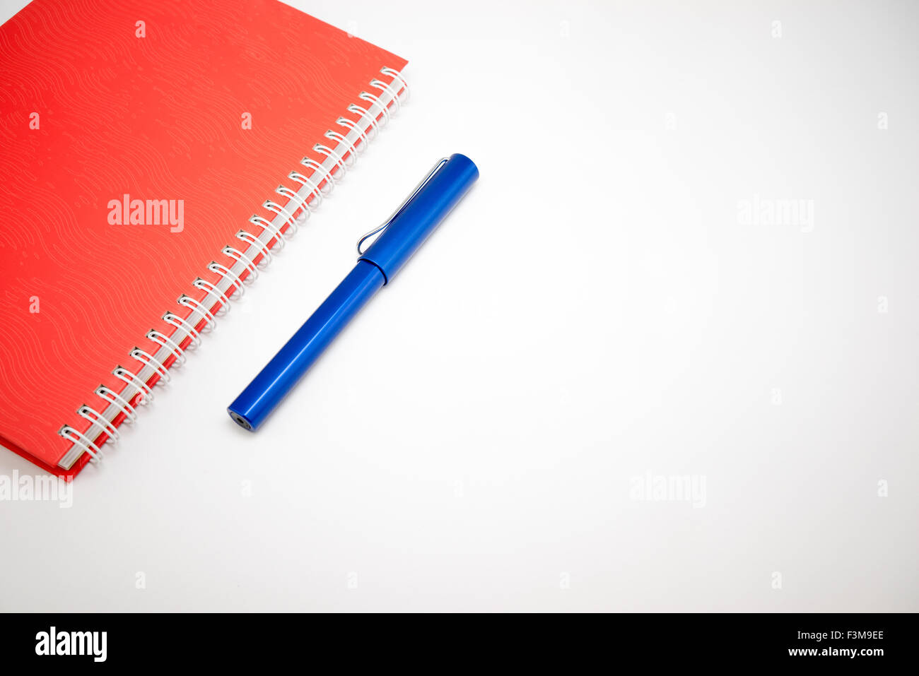 Notebook and pen isolated on white background Stock Photo - Alamy