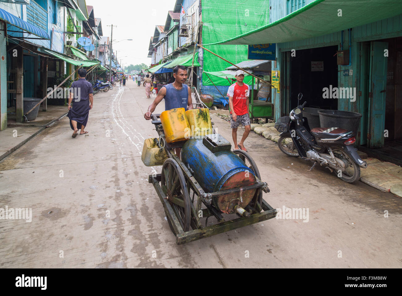 Water vendor in Labutta Township in the Ayeyarwady Division of Myanmar ...