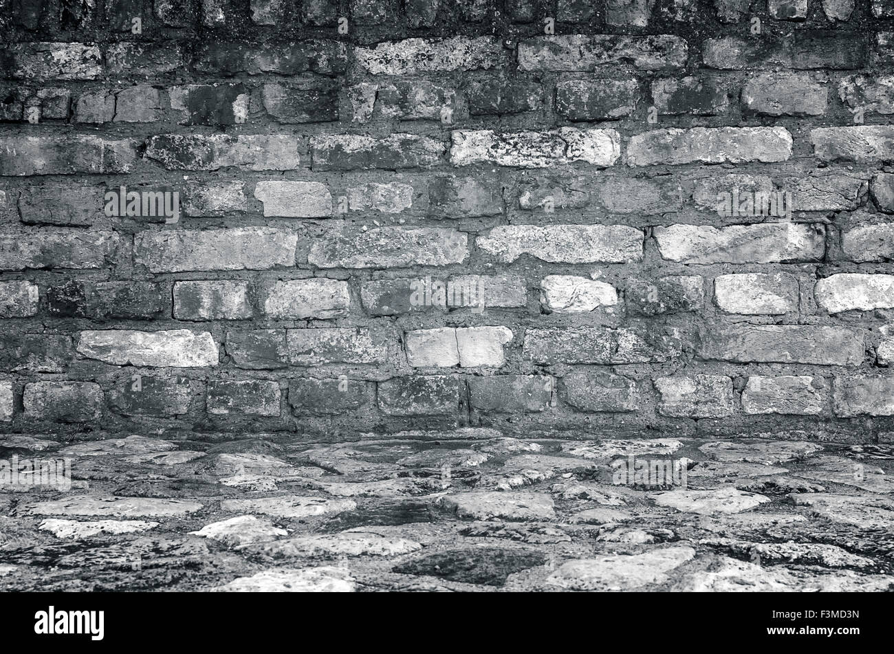 Old empty brick wall with stone floor, gray interior background Stock ...