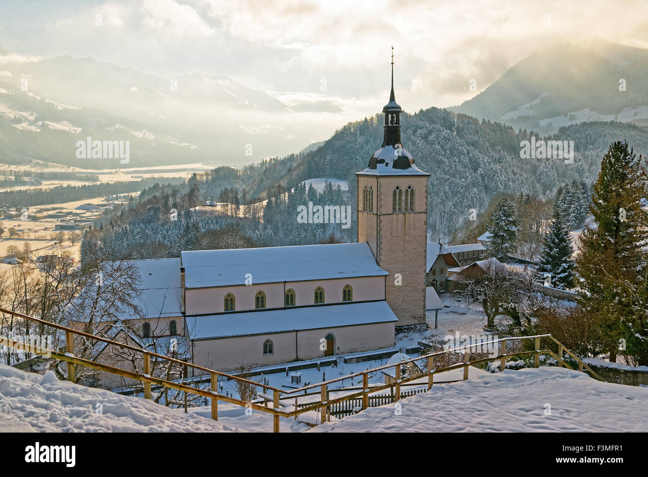 View of the picturesque old church near Gruyere castle and Swiss Alps ...