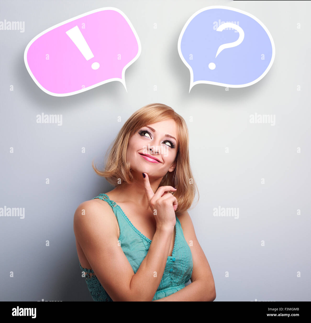 Thinking cute young woman with question and exclamation signs in ...