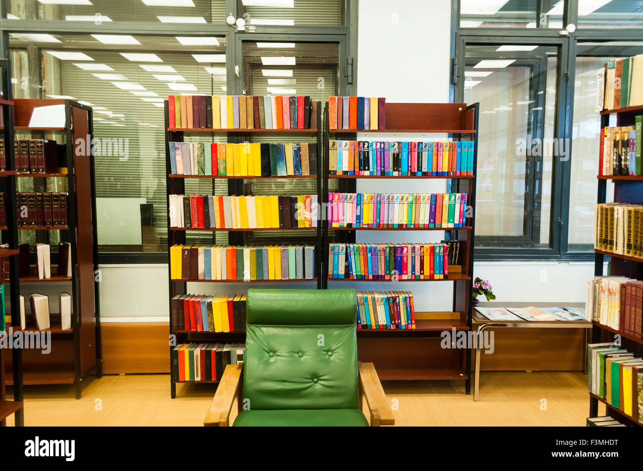 Old books in wooden bookcases in library Stock Photo - Alamy