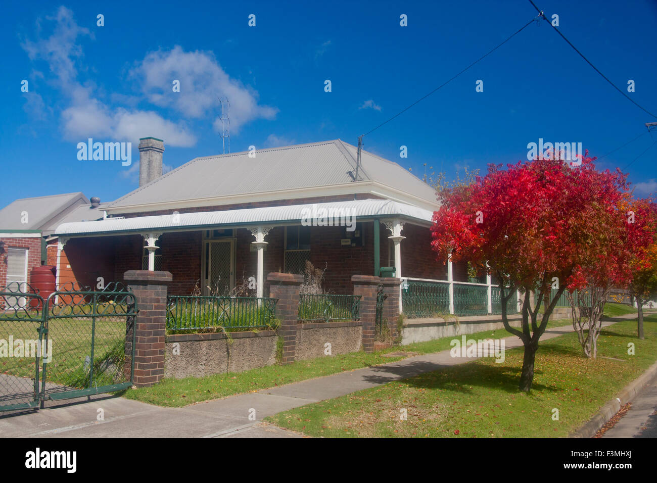 Traditional Australian house with verandah with tree outside with red ...