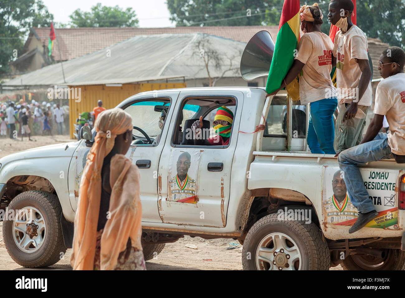 Car with activists heading to an eletoral campaign rally for Jomav ...