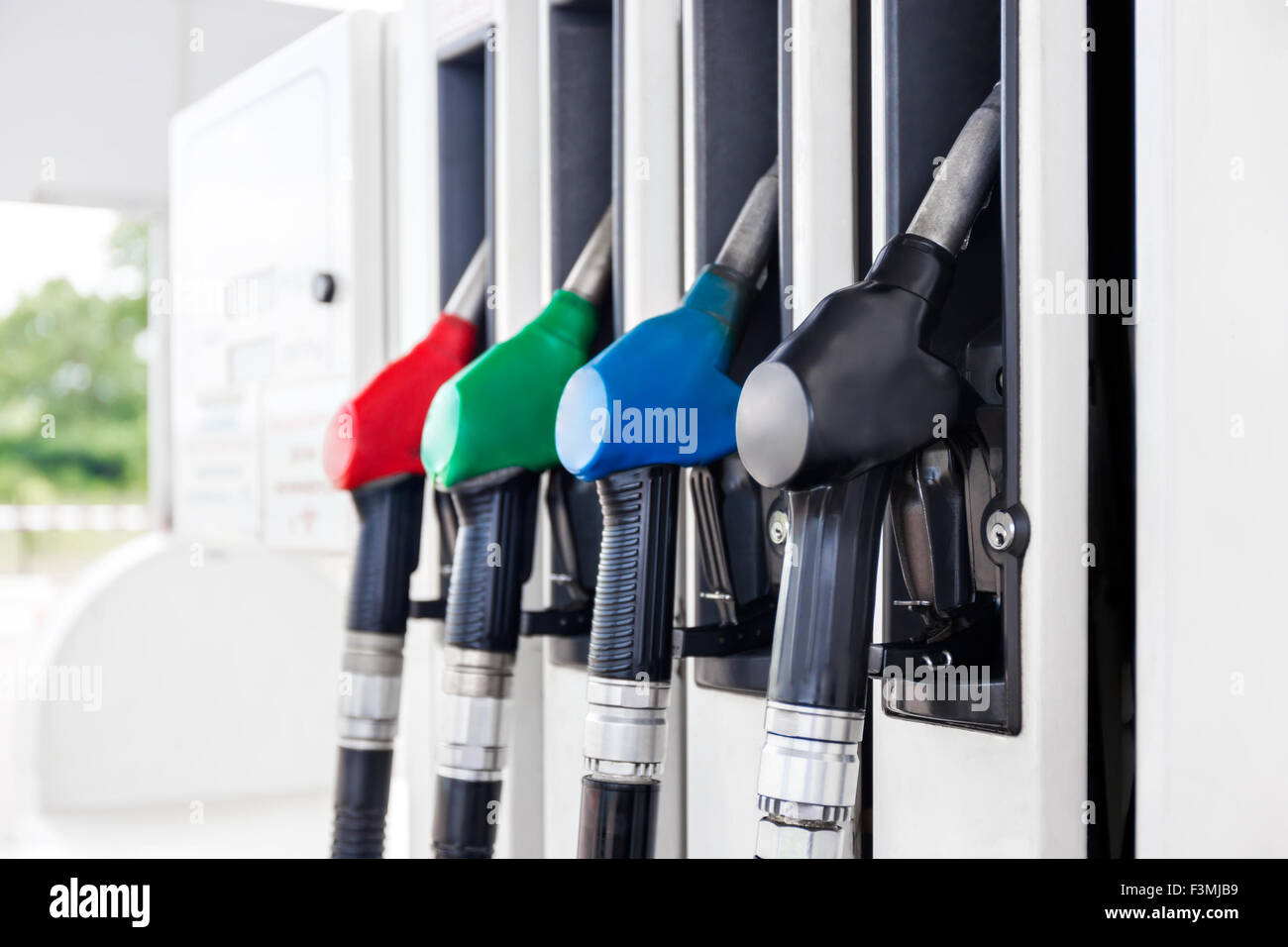 Coloured fuel nozzles Stock Photo - Alamy