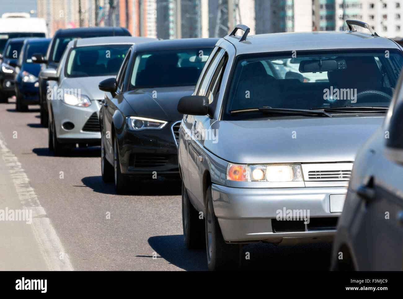 Generic cars standing in a queue during traffic jam Stock Photo - Alamy