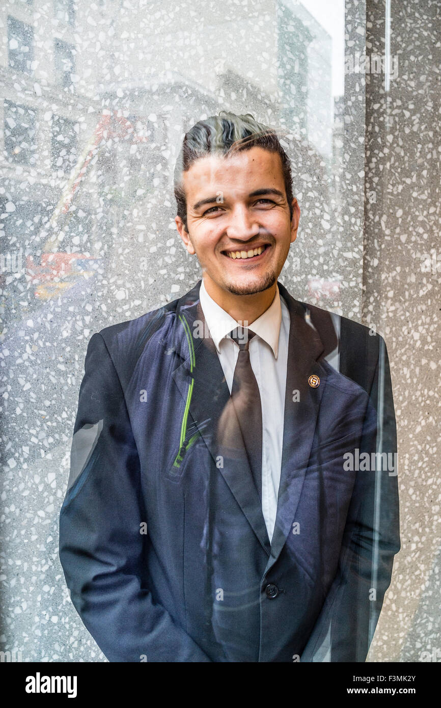 A well-dressed millennium male employee of a high-end San Francisco ...