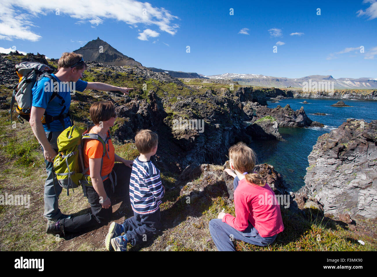 Family on the Hellnar-Arnarstapi coastal path, Snaefellsnes Peninsula ...