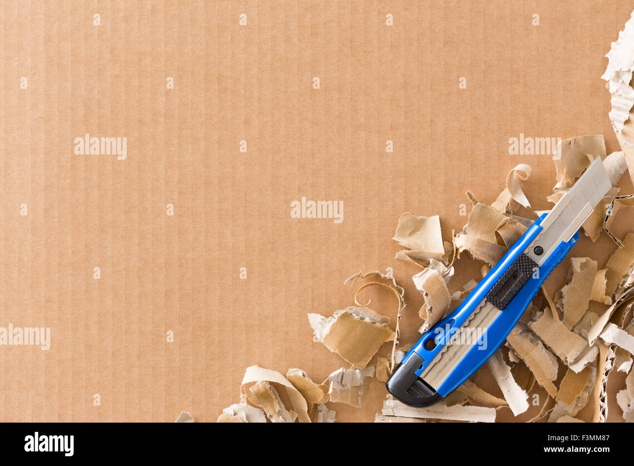 Cardboard and paper knife Stock Photo - Alamy