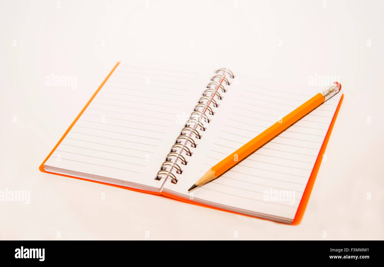 Notebook and pencil Stock Photo - Alamy