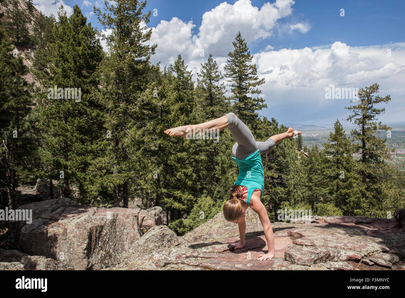 strong female holds a hand stand position Stock Photo - Alamy