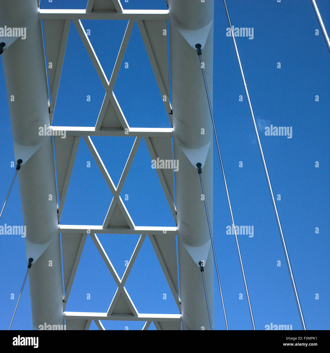 White steel curved modern bridge Stock Photo - Alamy