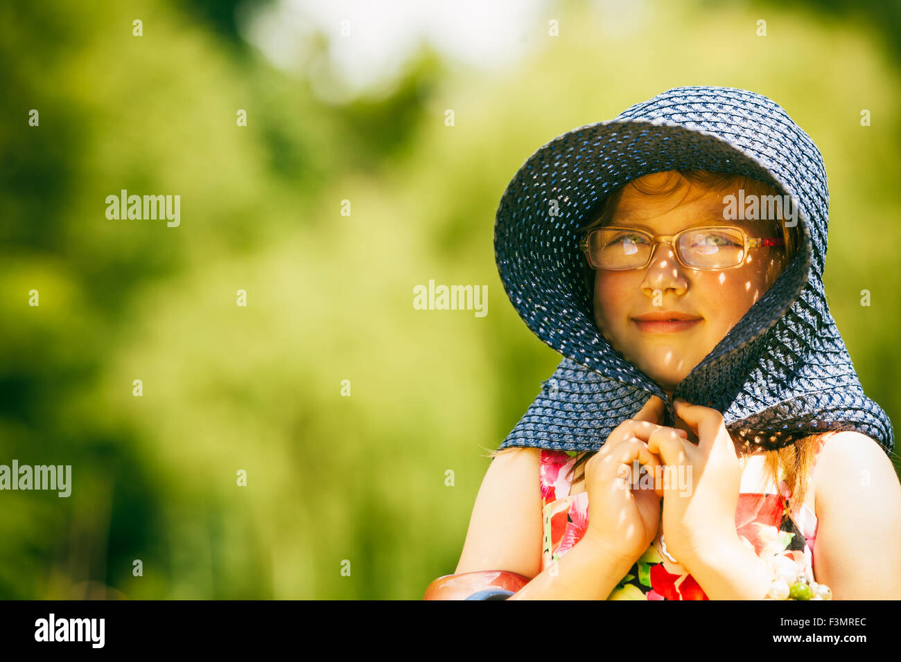Little girl child wearing big hat on picnic. Summer vacation leisure ...