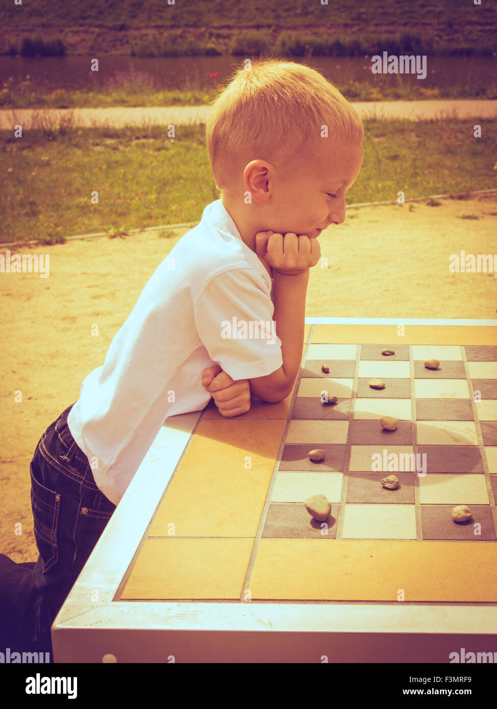 Draughts board game. Little boy clever child kid playing checkers ...
