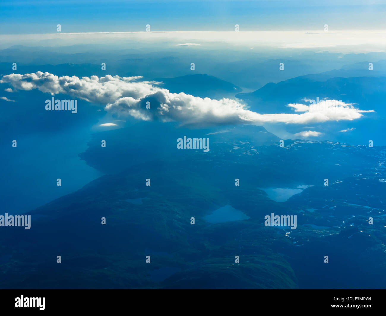 Birds eye. View from window of plane airplane flying over fjords Norway ...