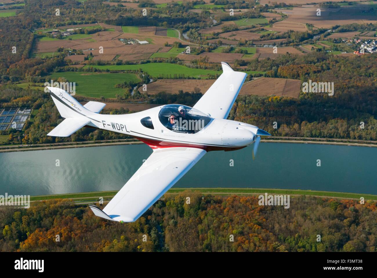 France, Bas Rhin (67), Aerospool Dynamic plane flying near Rhine river ...