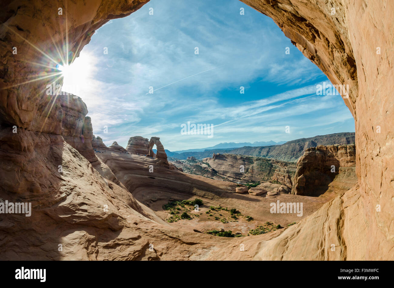 A view of Delicate Arch through Frame Arch early in a summer morning ...
