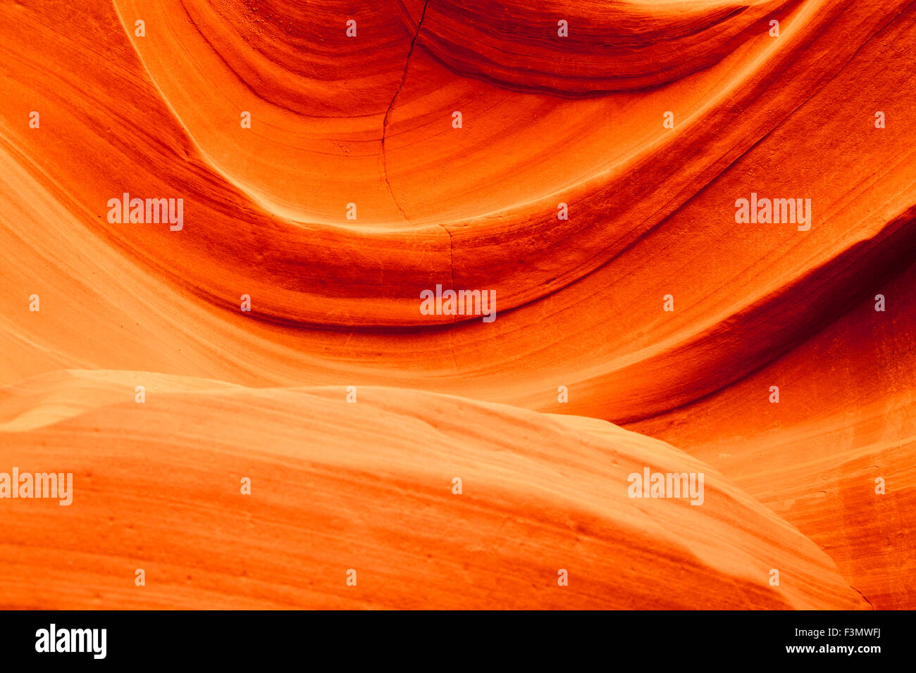 Background of vibrant orange swirling sandstone rocks inside of Upper ...