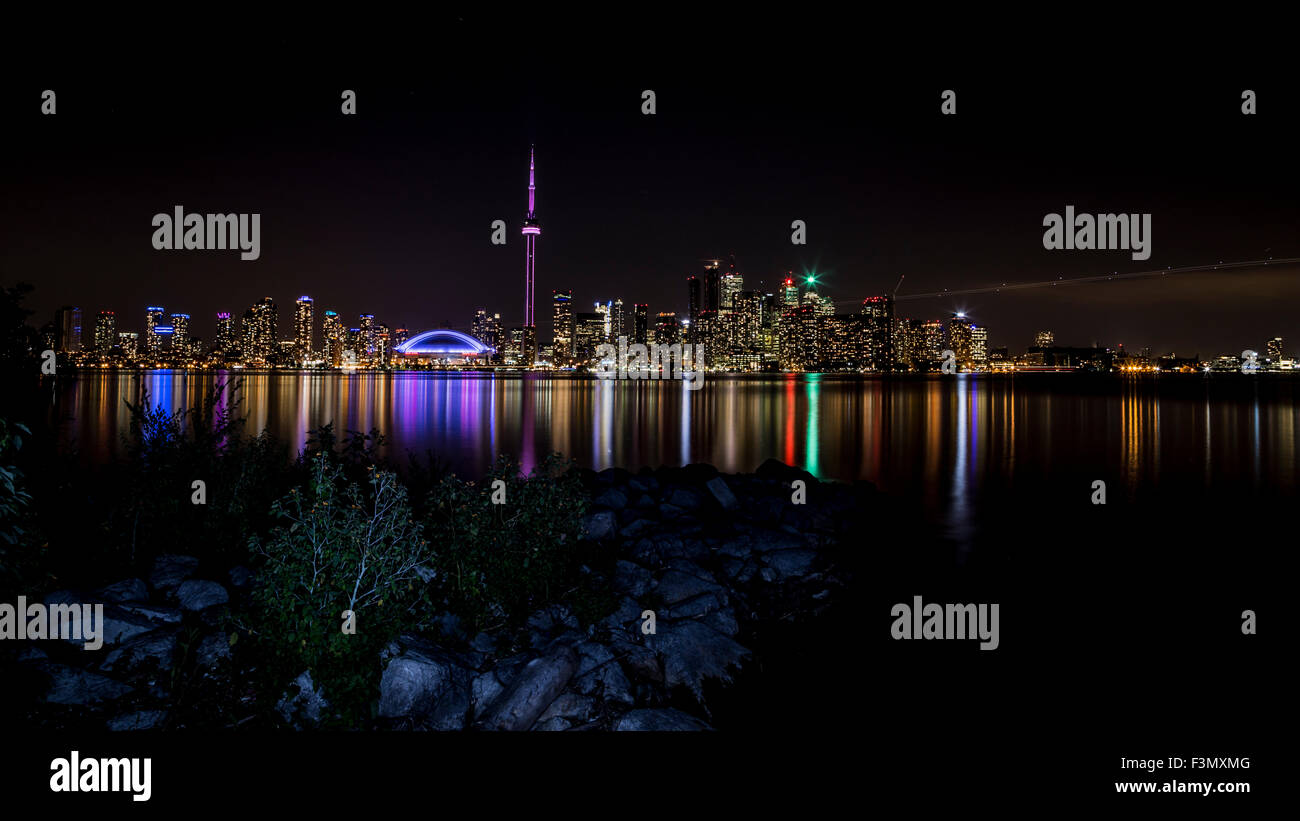 The Toronto skyline at night, from Centre Island in Toronto Stock Photo ...
