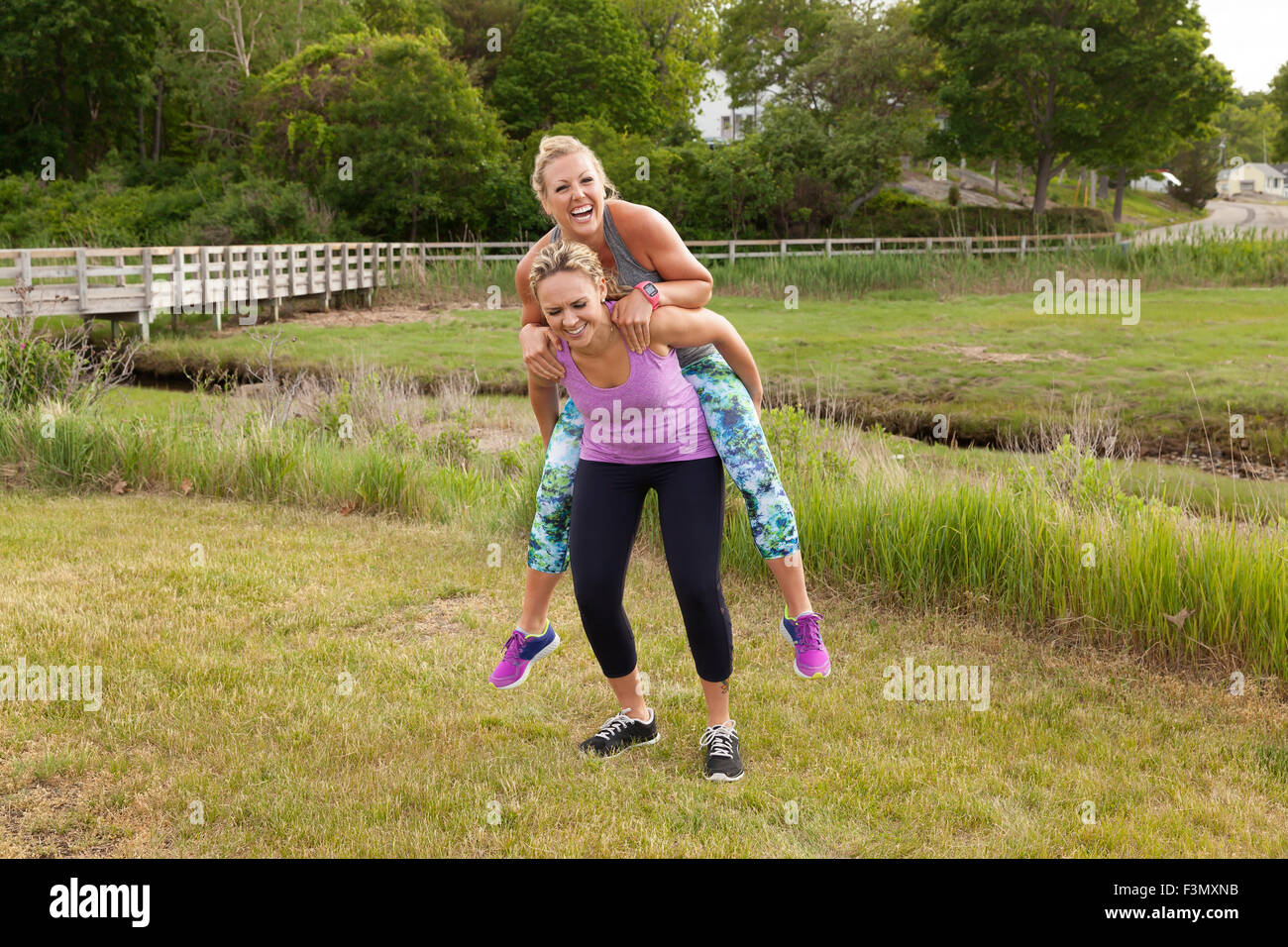 Laughing and piggyback riding Stock Photo - Alamy