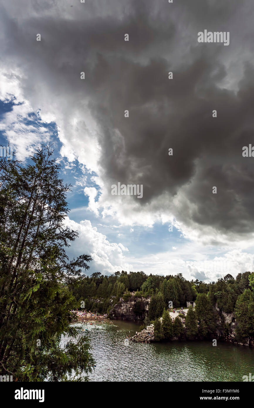 Elora Quarry with storm clouds above Stock Photo - Alamy