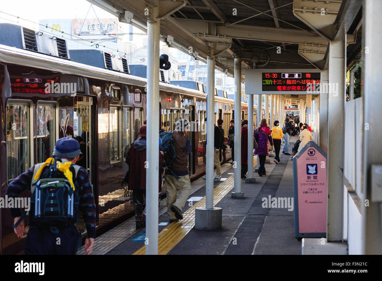 Japan, Shukugawa, Hankyu railway station. View along train and platform ...