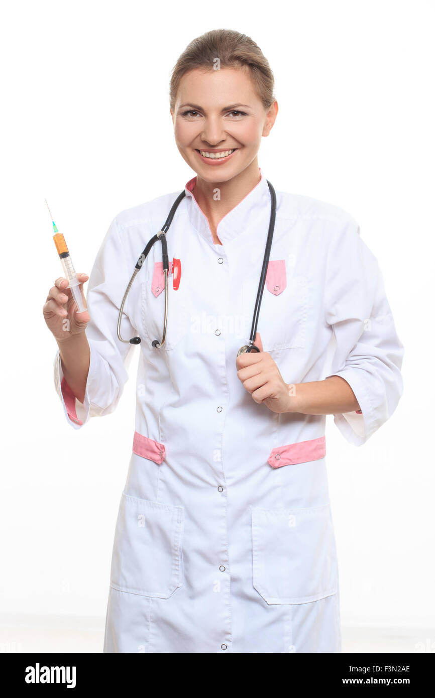 Young female doctor holding a syringe Stock Photo - Alamy