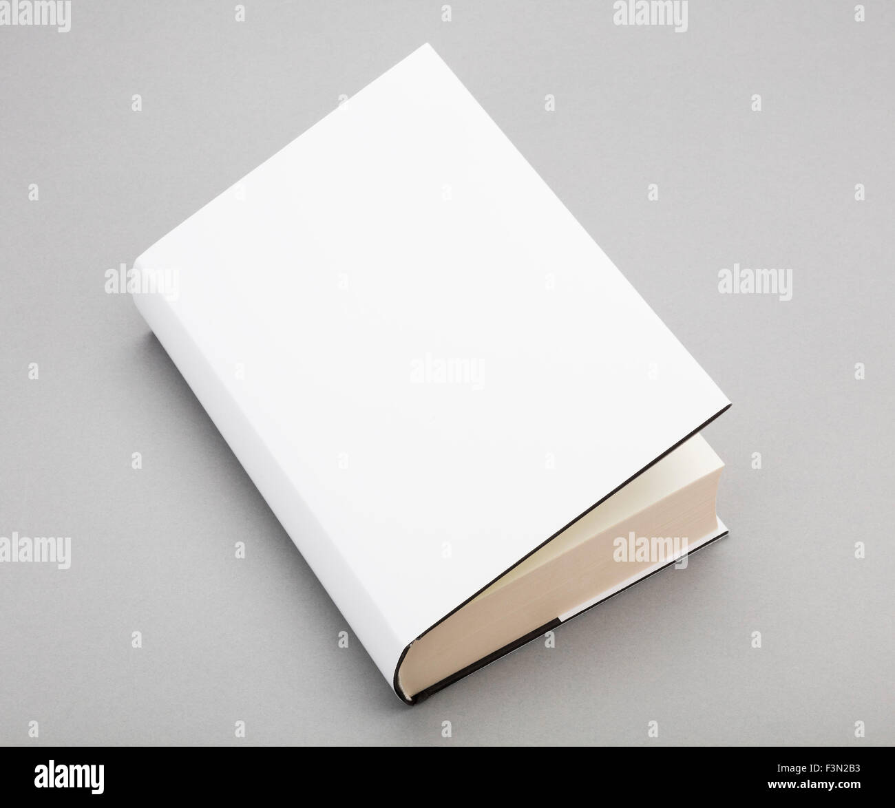 Thick Blank book with ajar white cover Stock Photo - Alamy