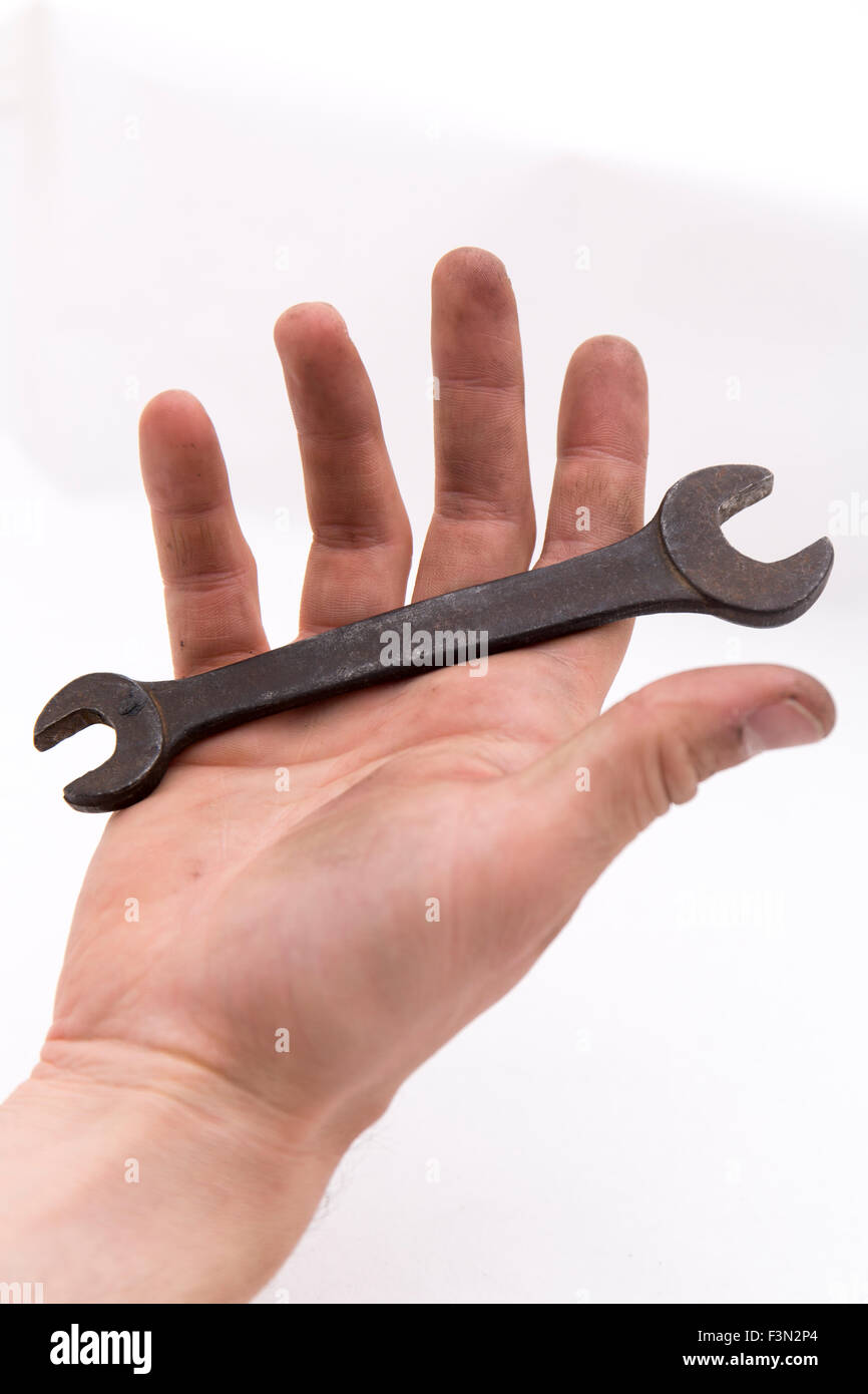 Wrench in the hand Stock Photo - Alamy