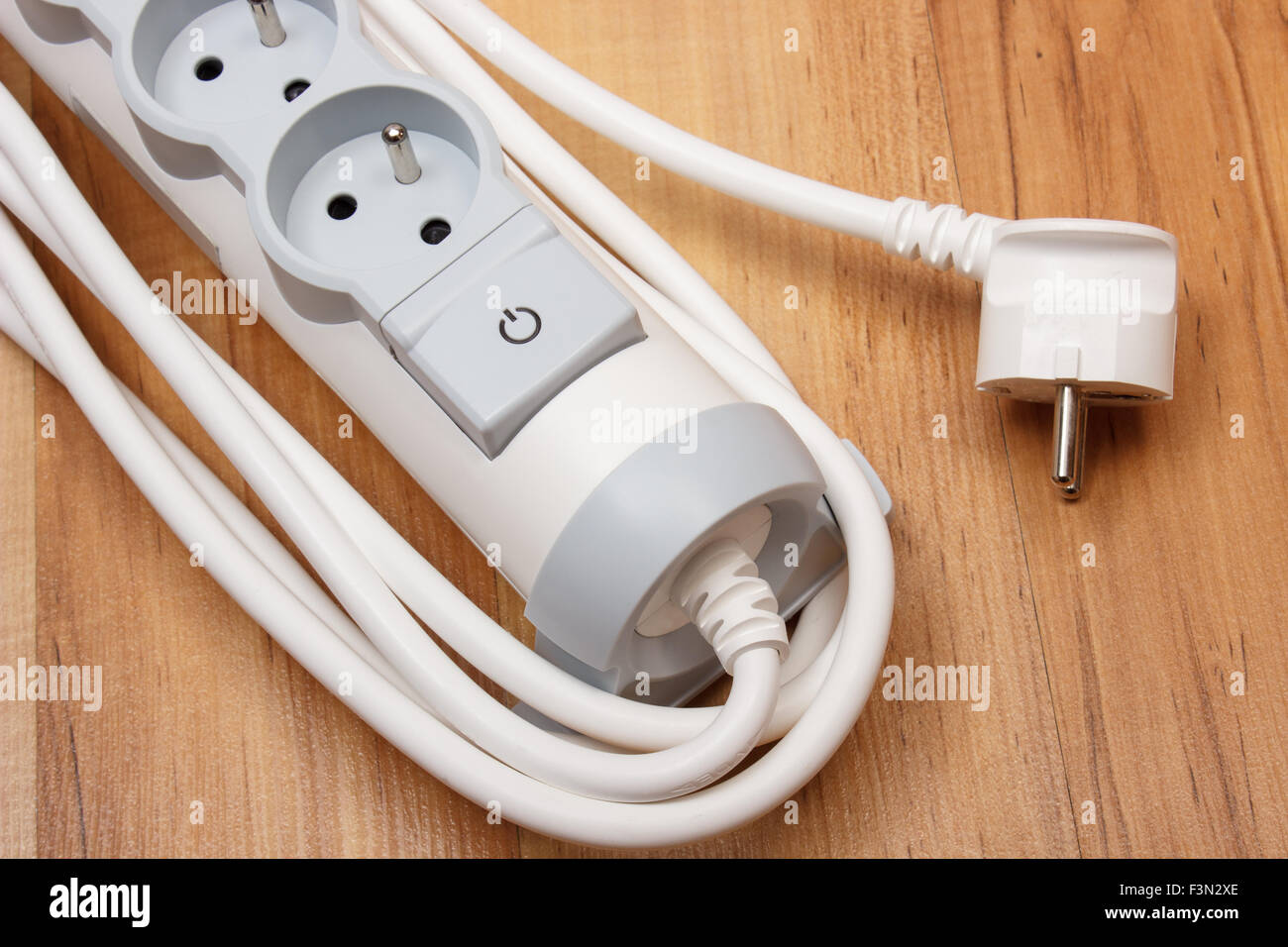 Electrical power strip with switch on-off on wooden floor, electrical ...