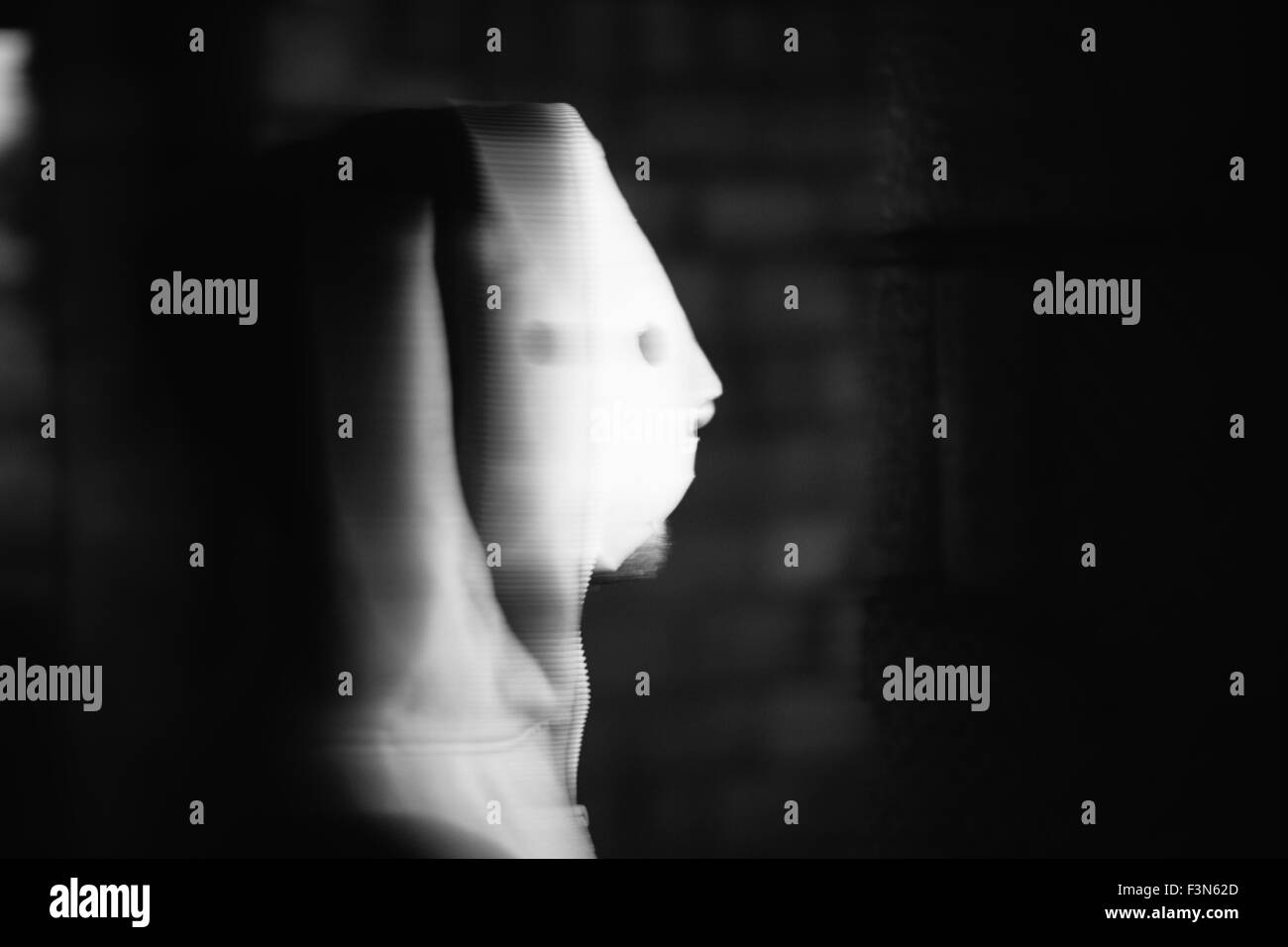 Black and white photo of a masked maniac side view Stock Photo - Alamy