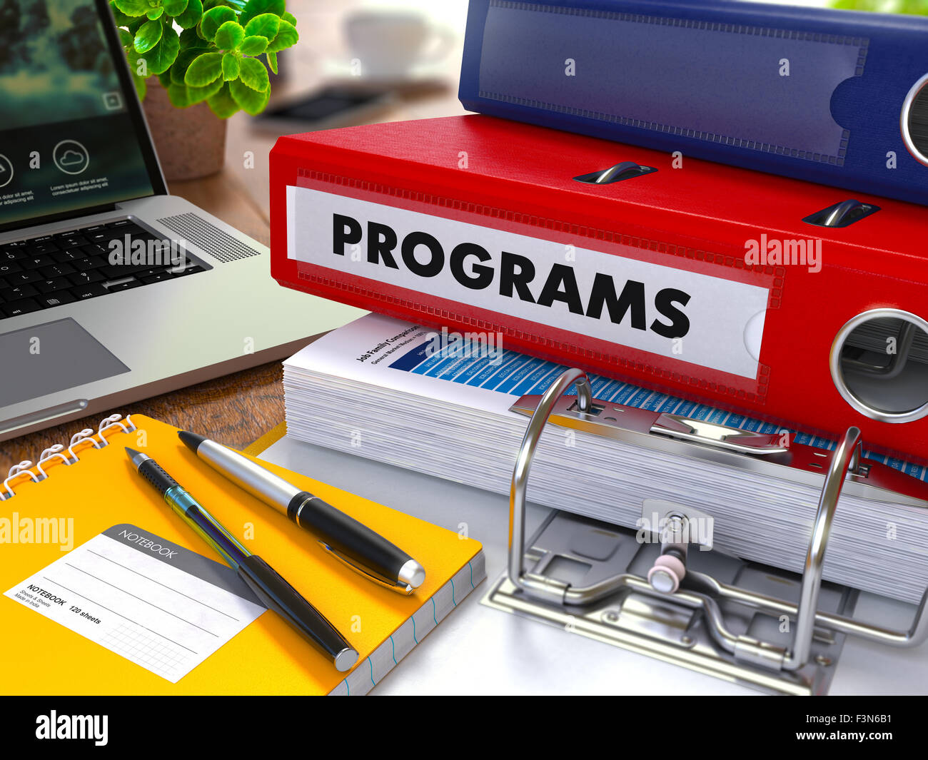 Red Ring Binder with Inscription Programs Stock Photo - Alamy