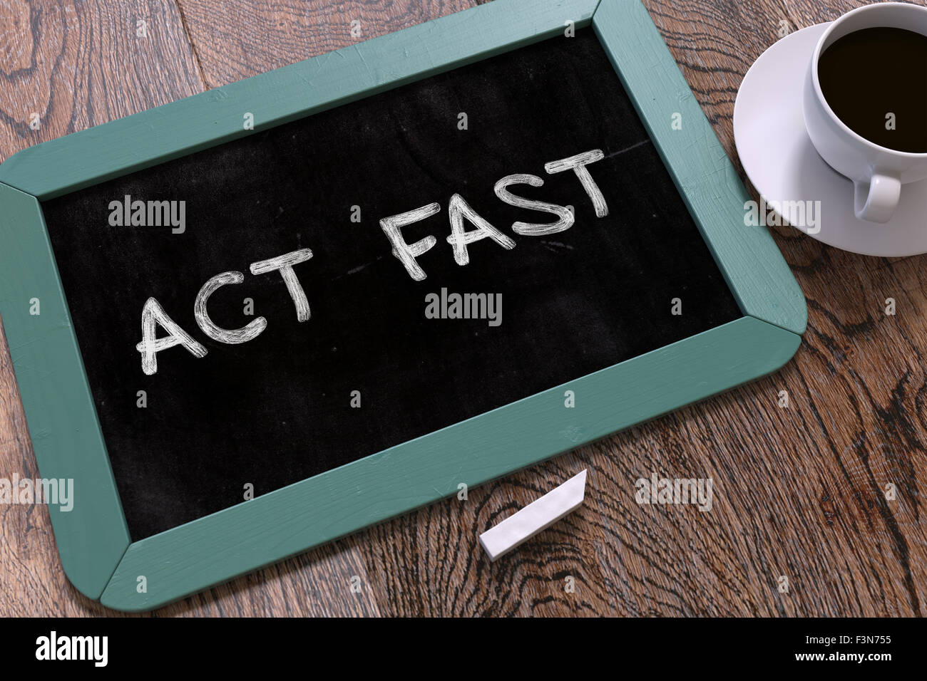 Act Fast - Chalkboard with Hand Drawn Text Stock Photo - Alamy