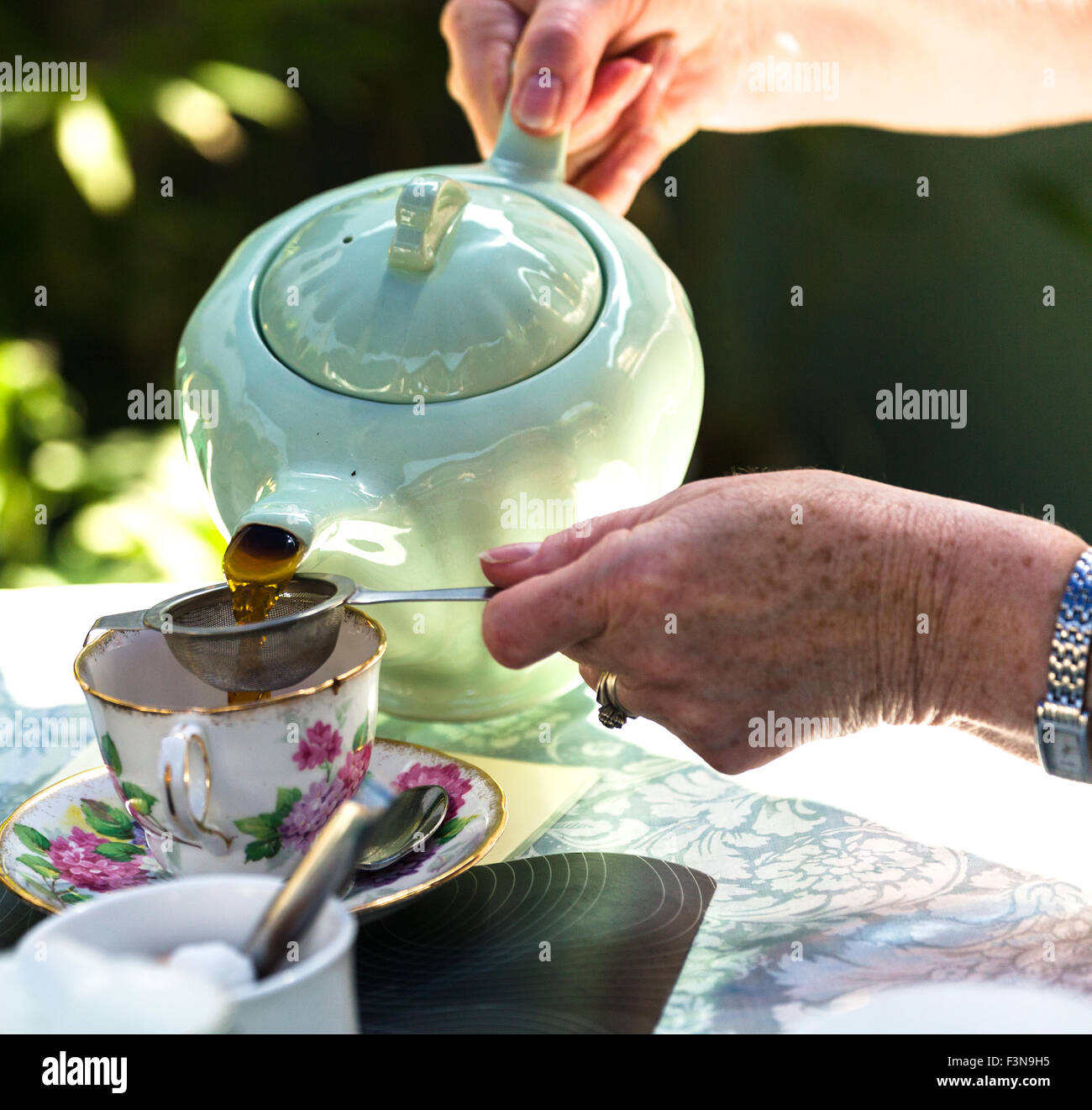 Pouring tea up close. Afternoon tea. Ludham village tearoom. Norfolk ...