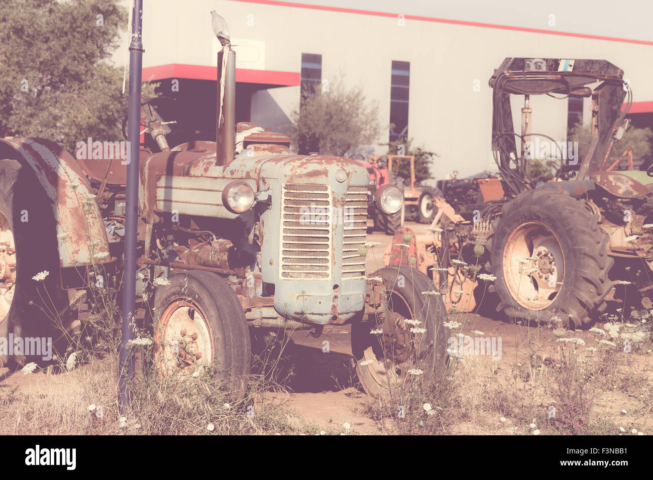 vintage photo of rusty tractor Stock Photo - Alamy