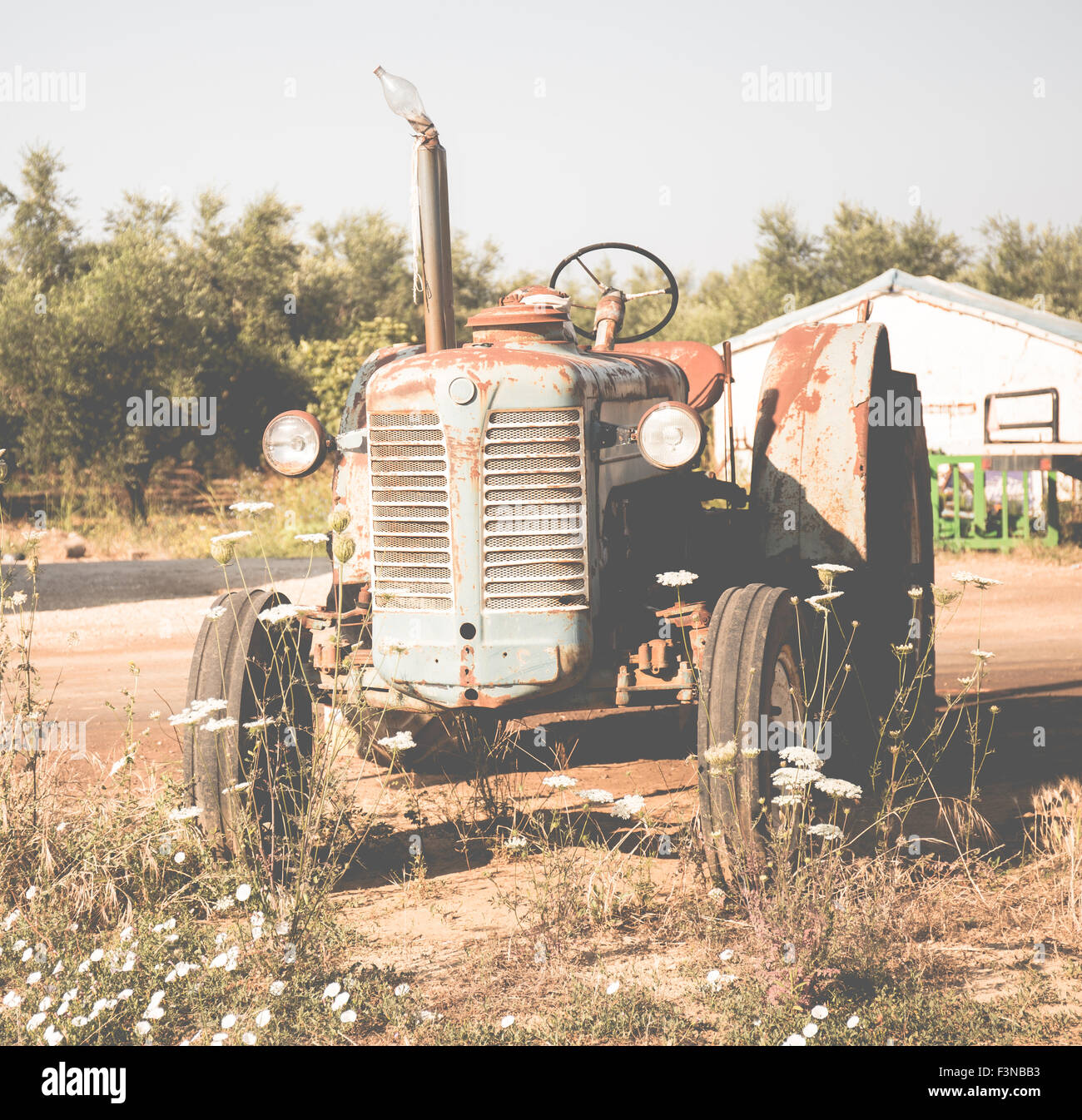 vintage photo of rusty tractor Stock Photo - Alamy