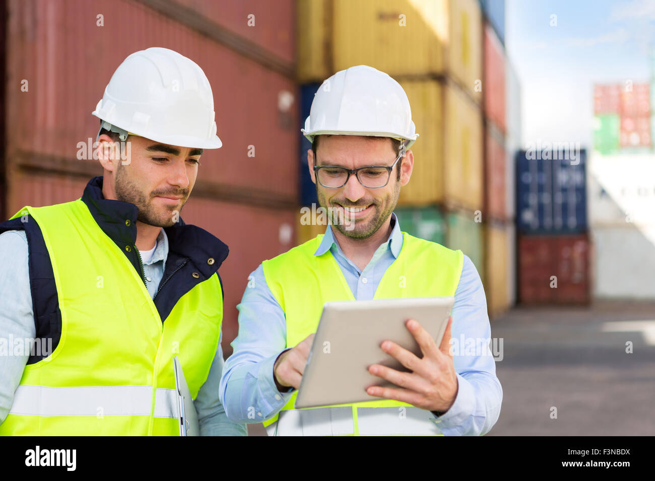 View of Two young attractives dockers working on the dock Stock Photo ...