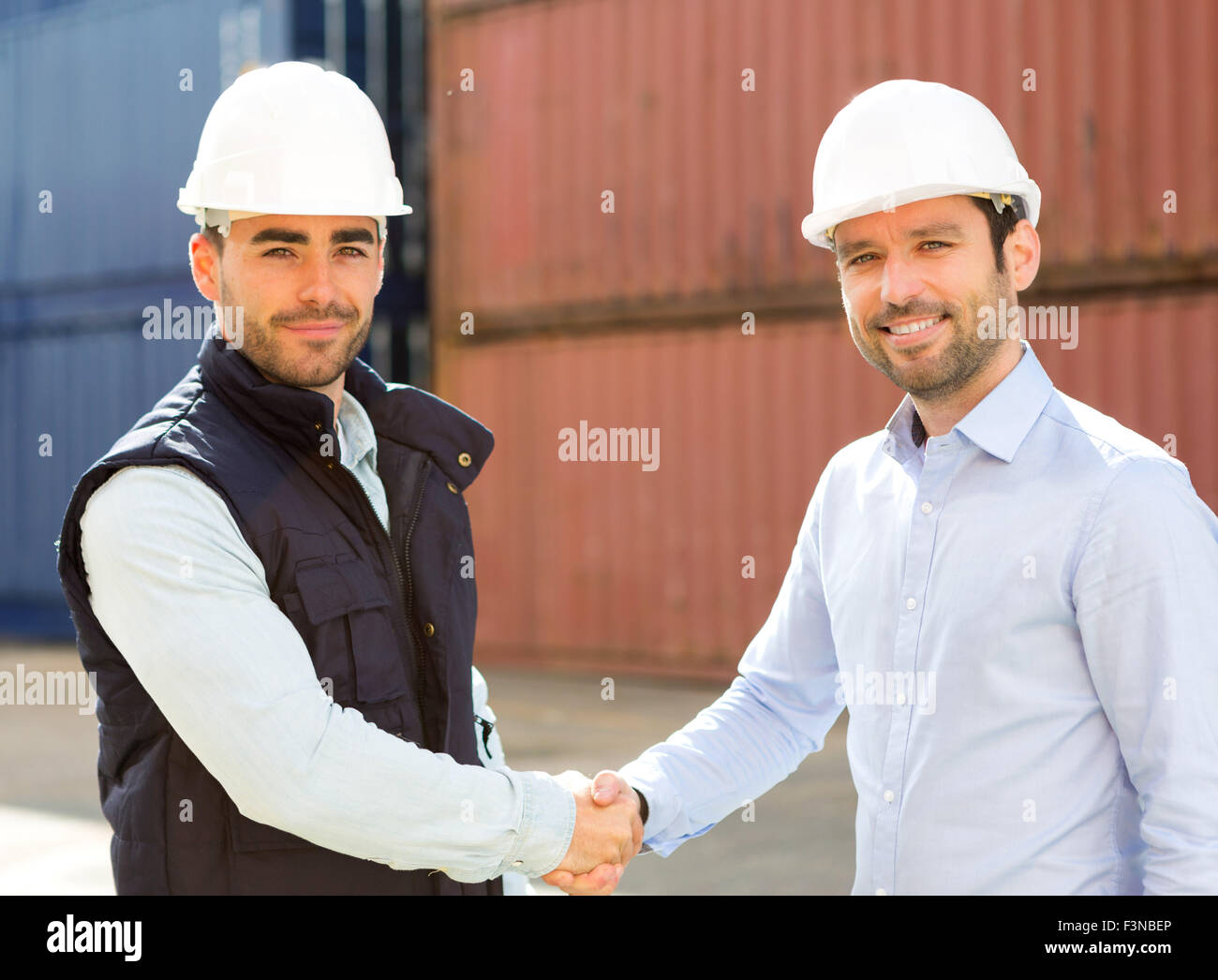 View of a Docker and supervisor handshaking in front of containers ...