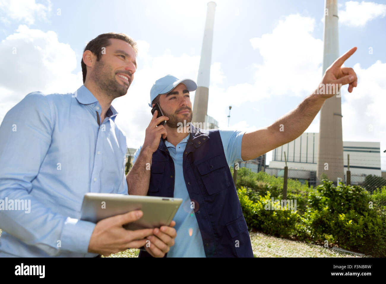 View of an Electrician and engineer working together at the electric ...