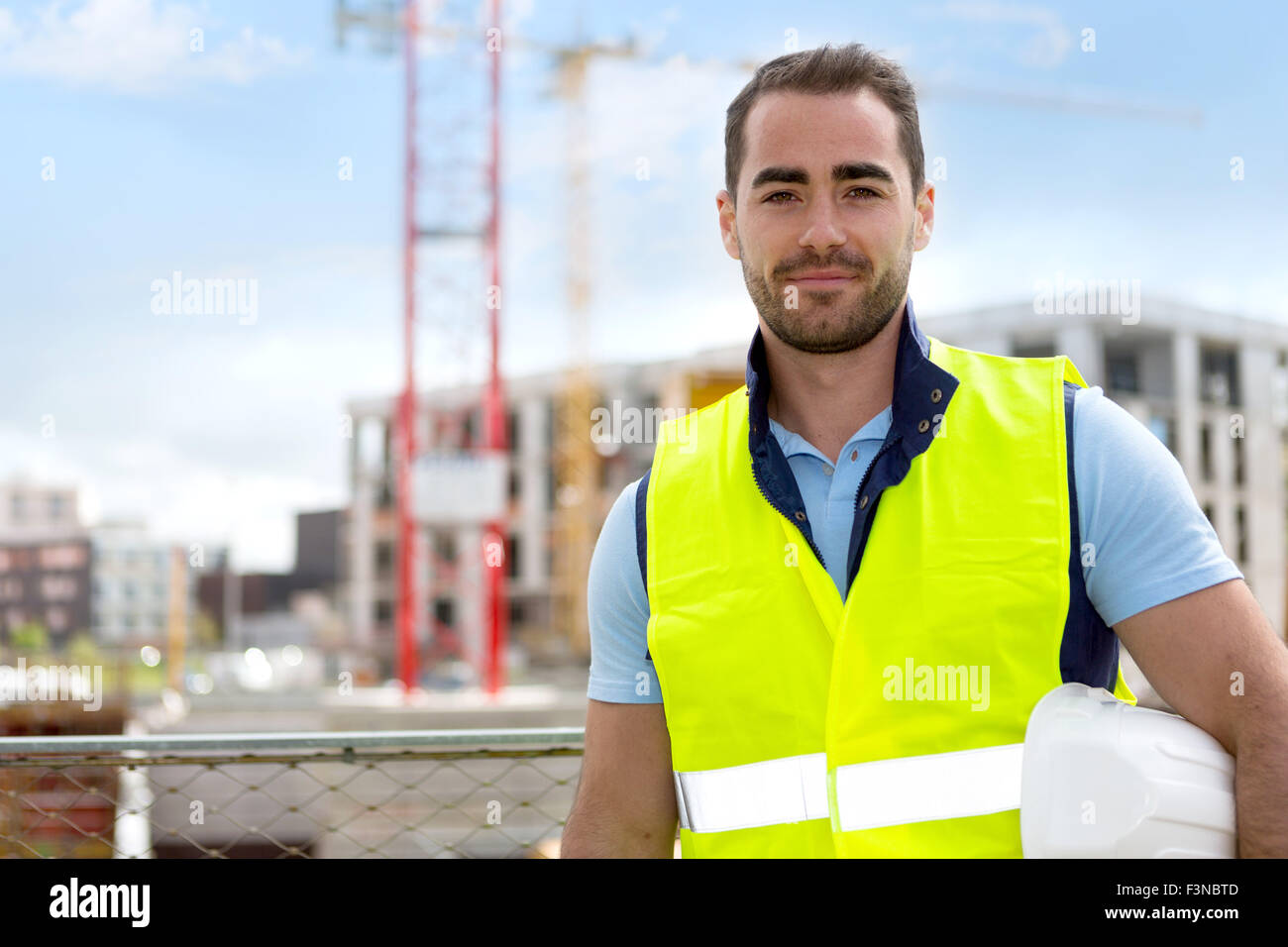 View of an attractive worker on a construction site Stock Photo - Alamy