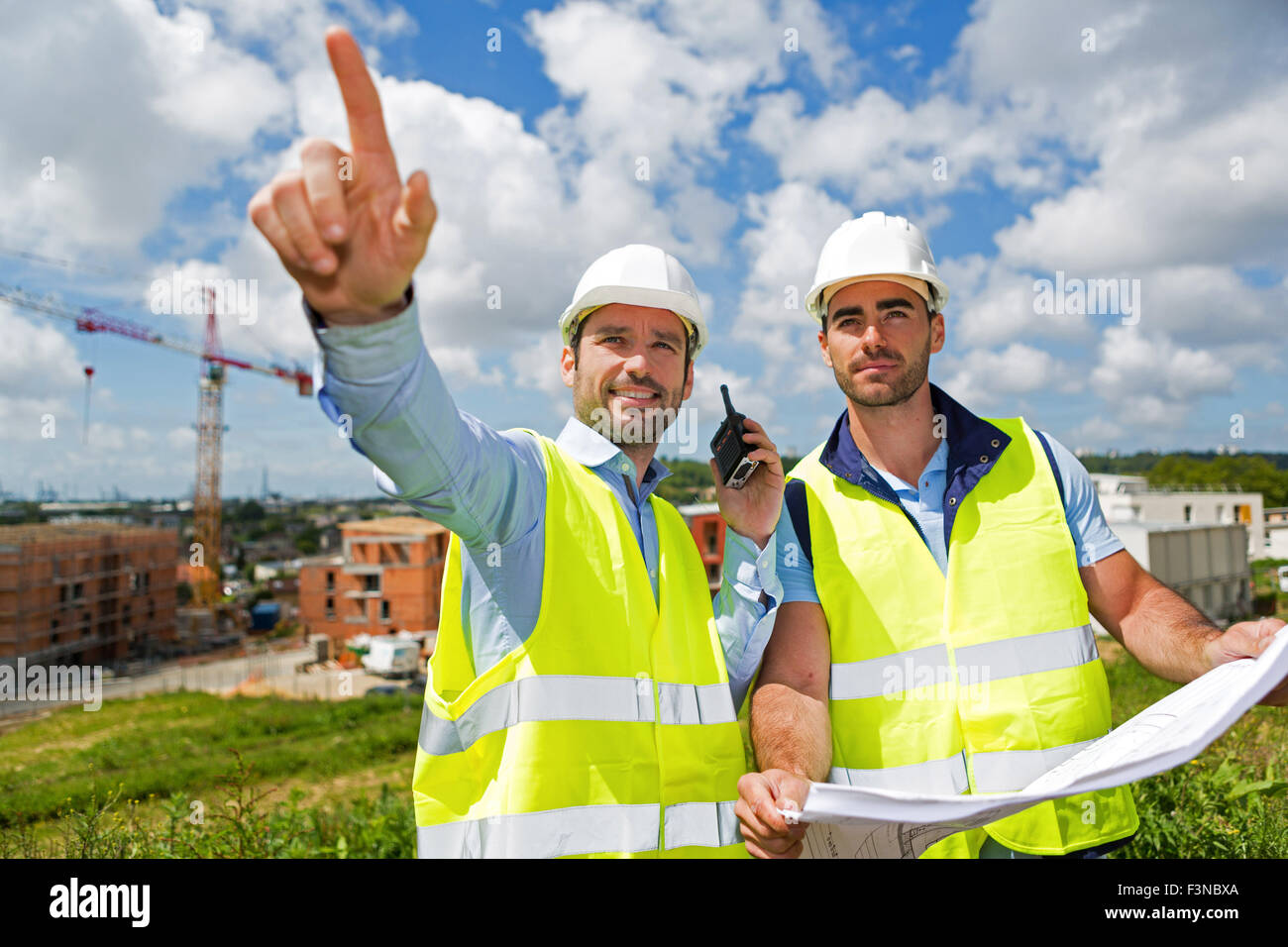 View of a Worker and architect watching some details on a construction ...