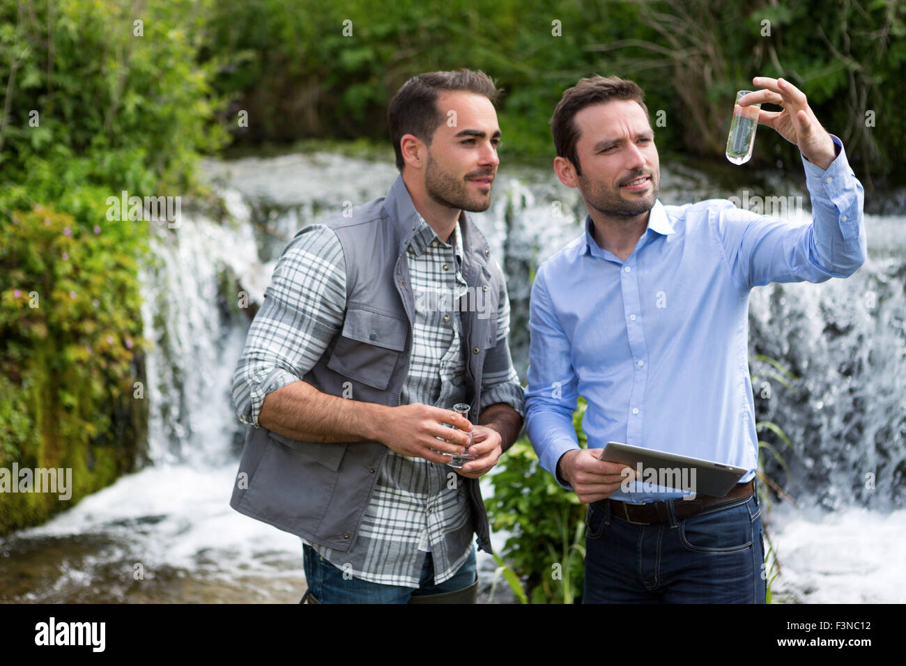 View of a Scientist and biologist working together on water analysis ...