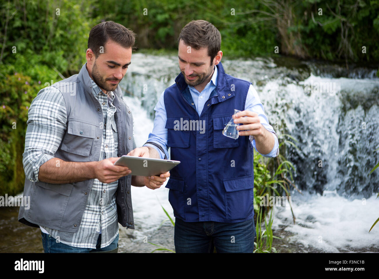 View of a Scientist and biologist working together on water analysis ...