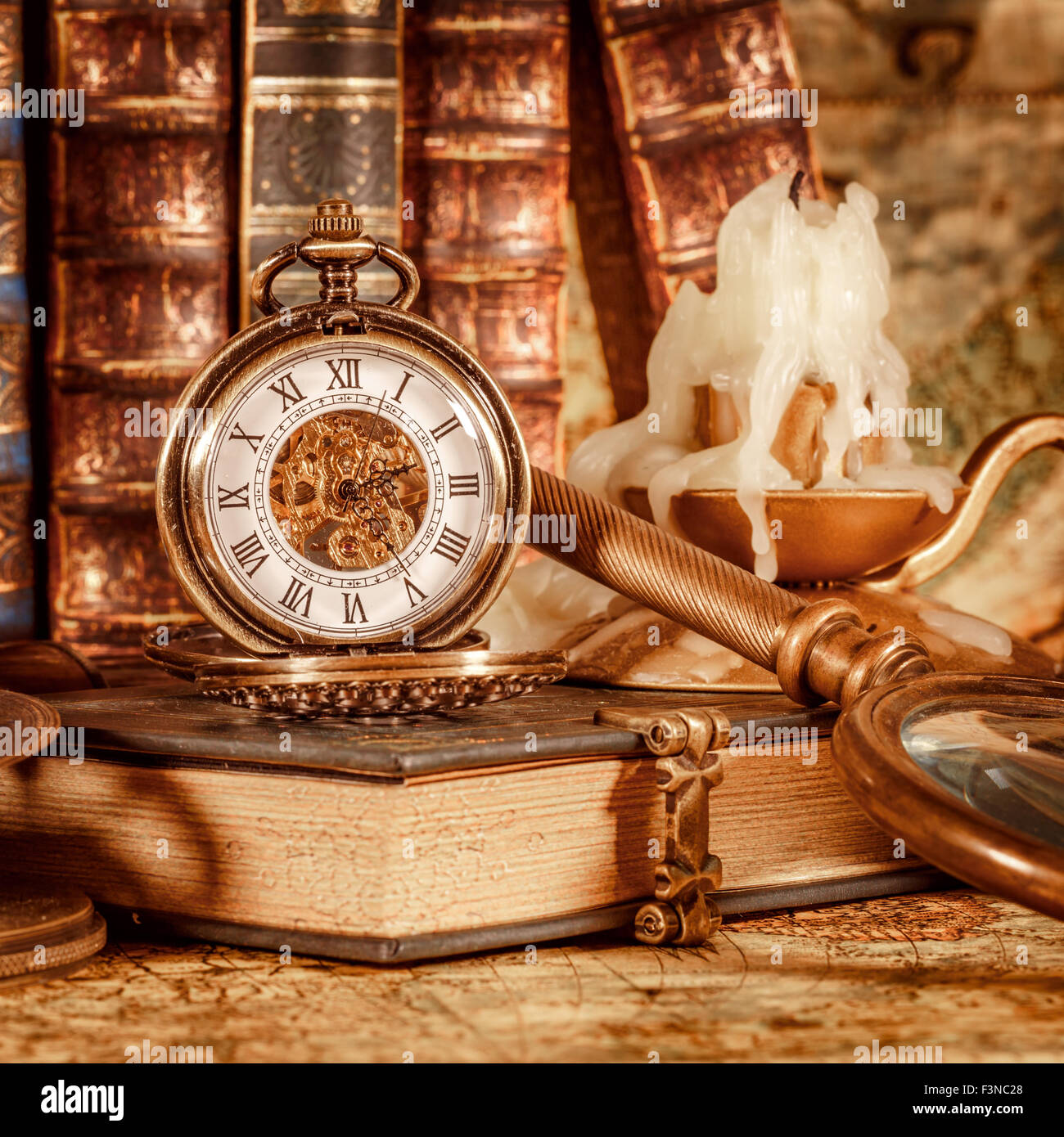 Vintage Antique pocket watch on the background of old books Stock Photo ...