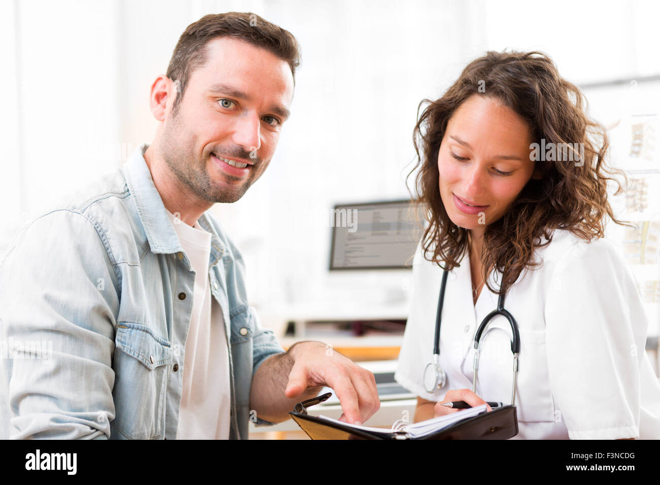View of a Young attractive doctor dating next appointment Stock Photo ...