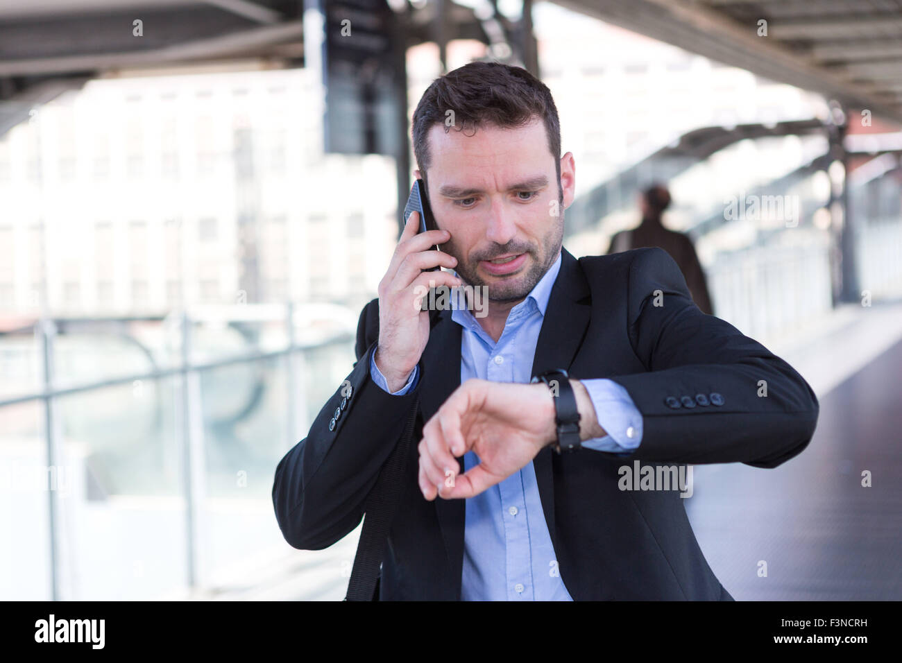 View of a Young attractive man being late to an appointment Stock Photo ...