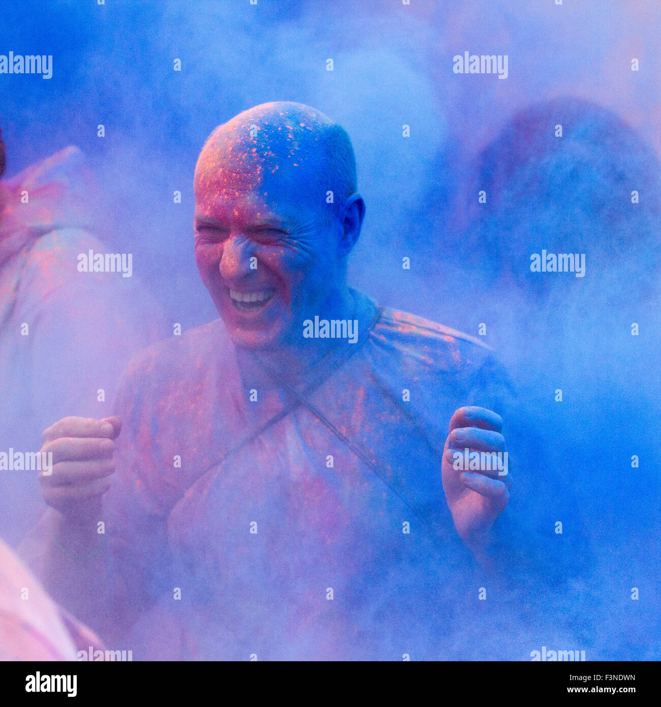 Color runners competitors in paint race splashed with colour at ...