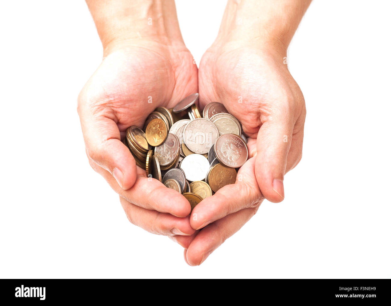 Handful of coins in palm hands isolated on white Stock Photo - Alamy