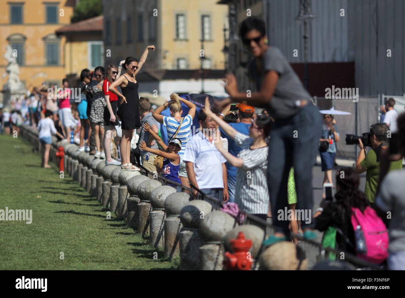 Pisa, Italy. 22nd July, 2015. People posing in front of the Leaning ...