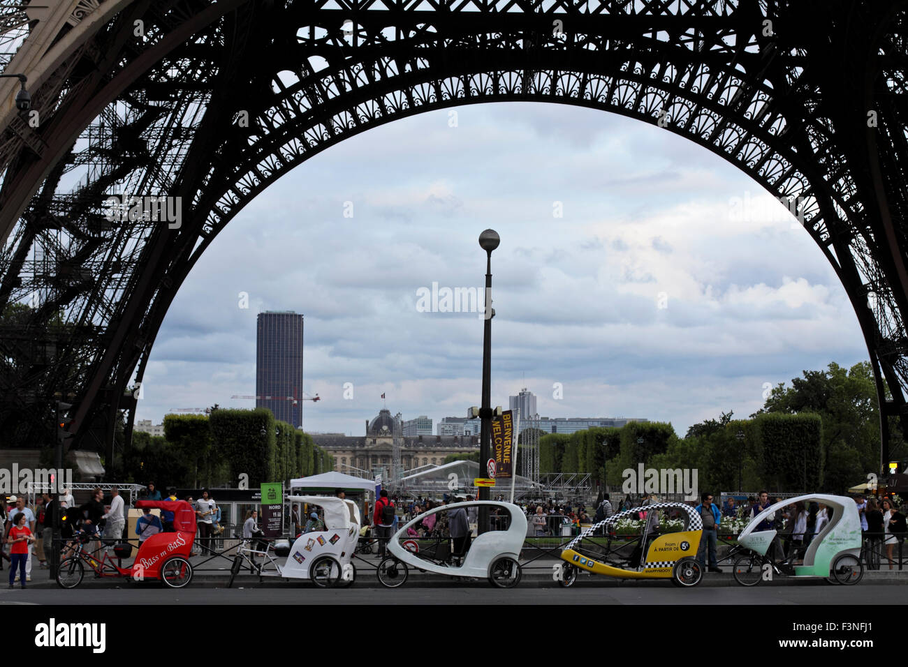 Rickshaws under the Eiffel Tower in Paris, France Stock Photo - Alamy